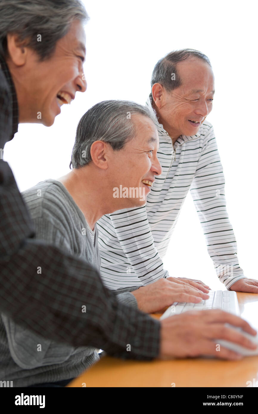 Senior Three Men at Computer Stock Photo - Alamy