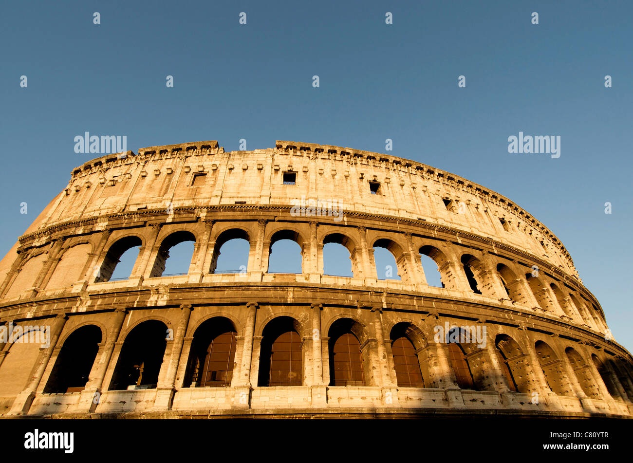 The grand Coliseum in Rome during the golden hour of late afternoon ...