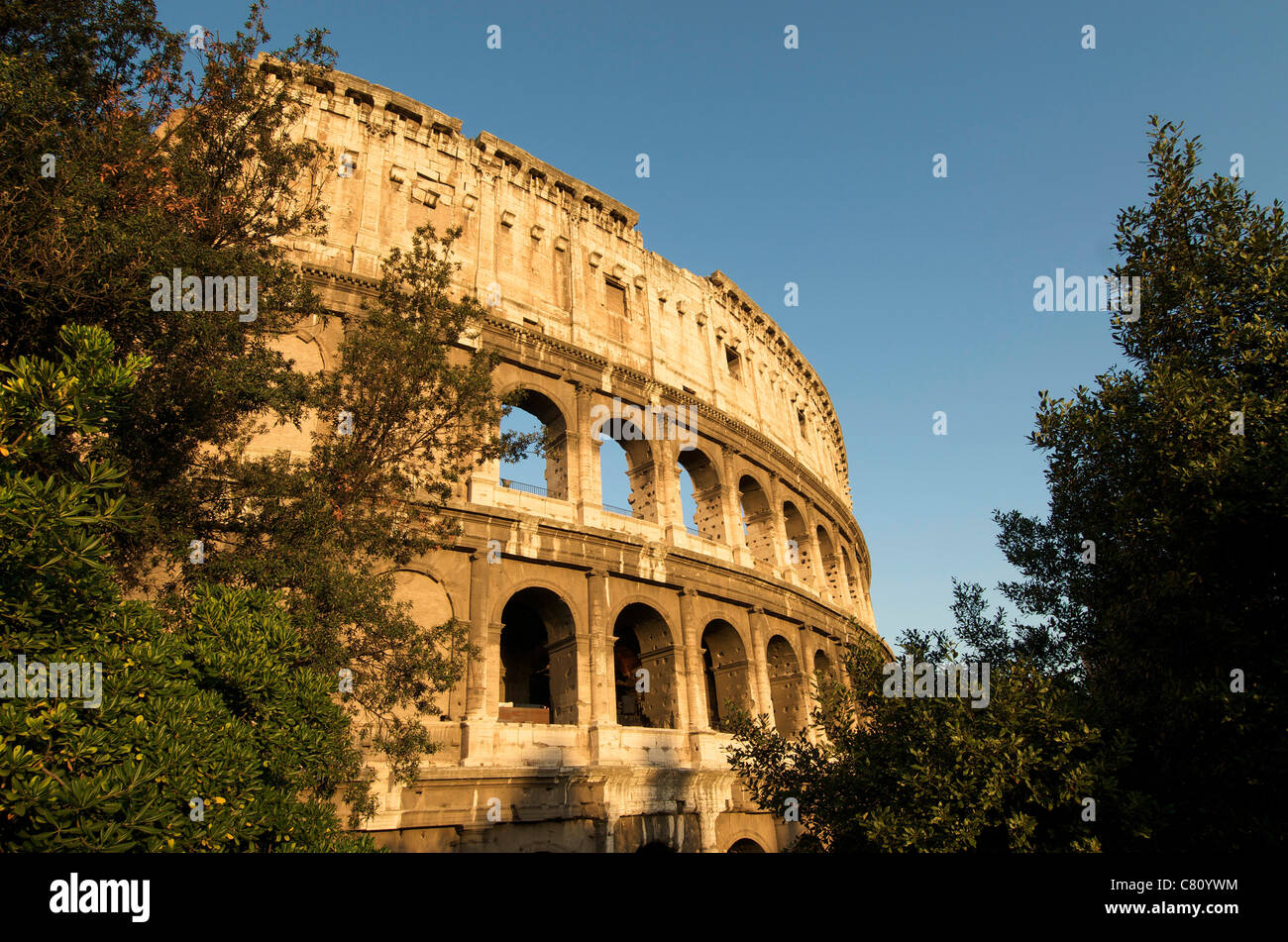The grand Coliseum in Rome during the golden hour of late afternoon ...