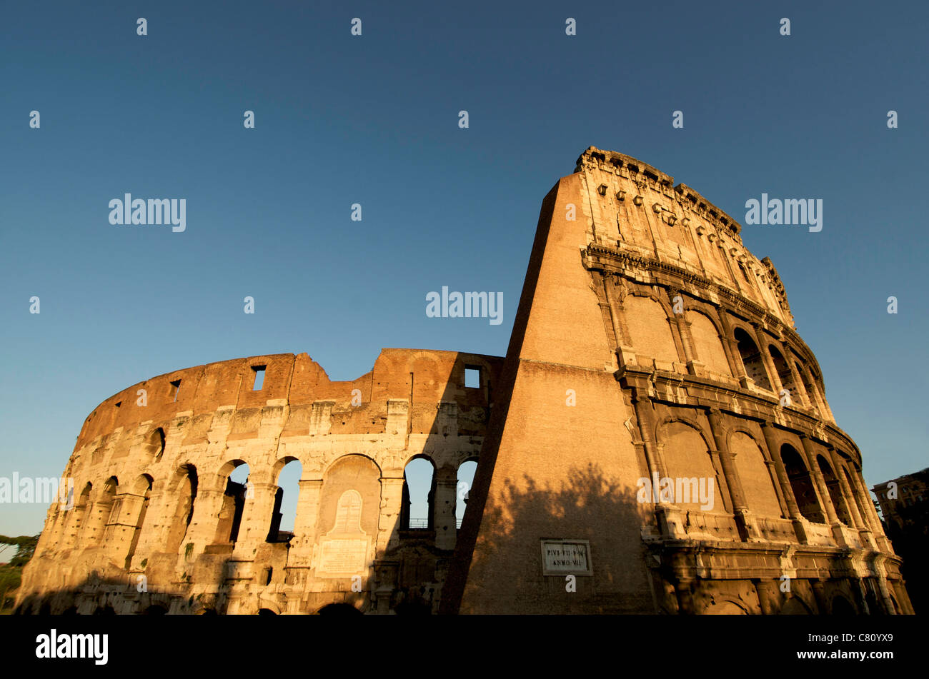 The grand Coliseum in Rome during the golden hour of late afternoon ...
