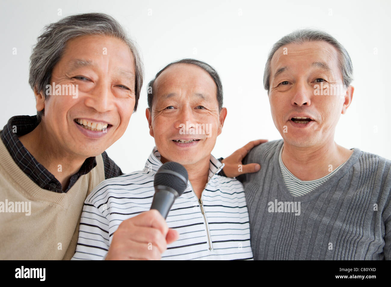 Three Senior Men Singing Karaoke Stock Photo - Alamy