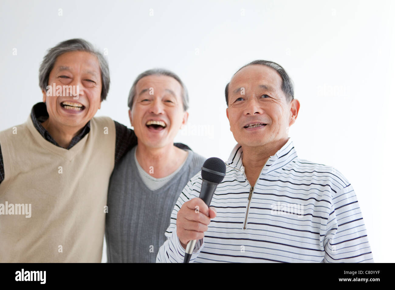 Three Senior Men Singing Karaoke Stock Photo - Alamy
