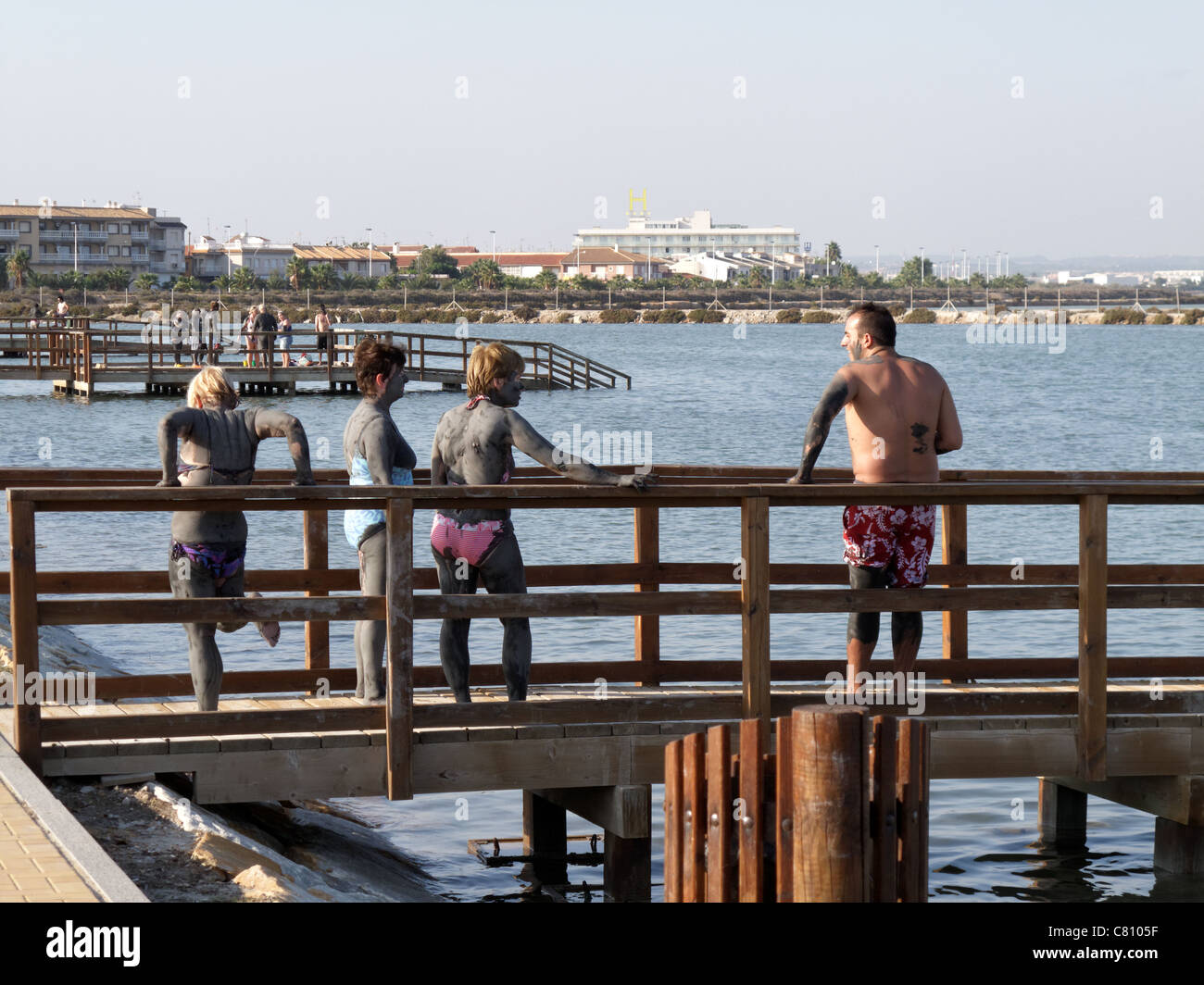 Bathers cover themselves in mud for medicinal reasons at Lo Pagan Spain ...