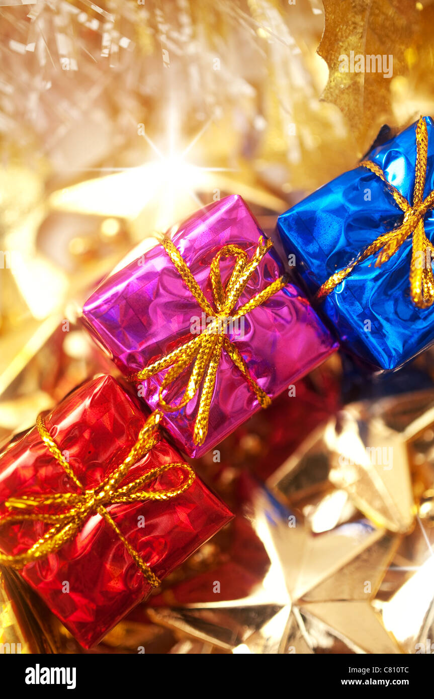 colorful gift boxes with decoration in gold Stock Photo - Alamy
