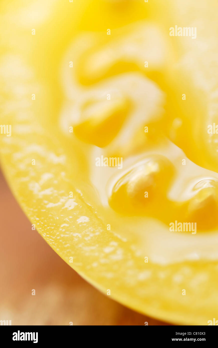 One 'Lemon Tree' tomato sliced Stock Photo - Alamy