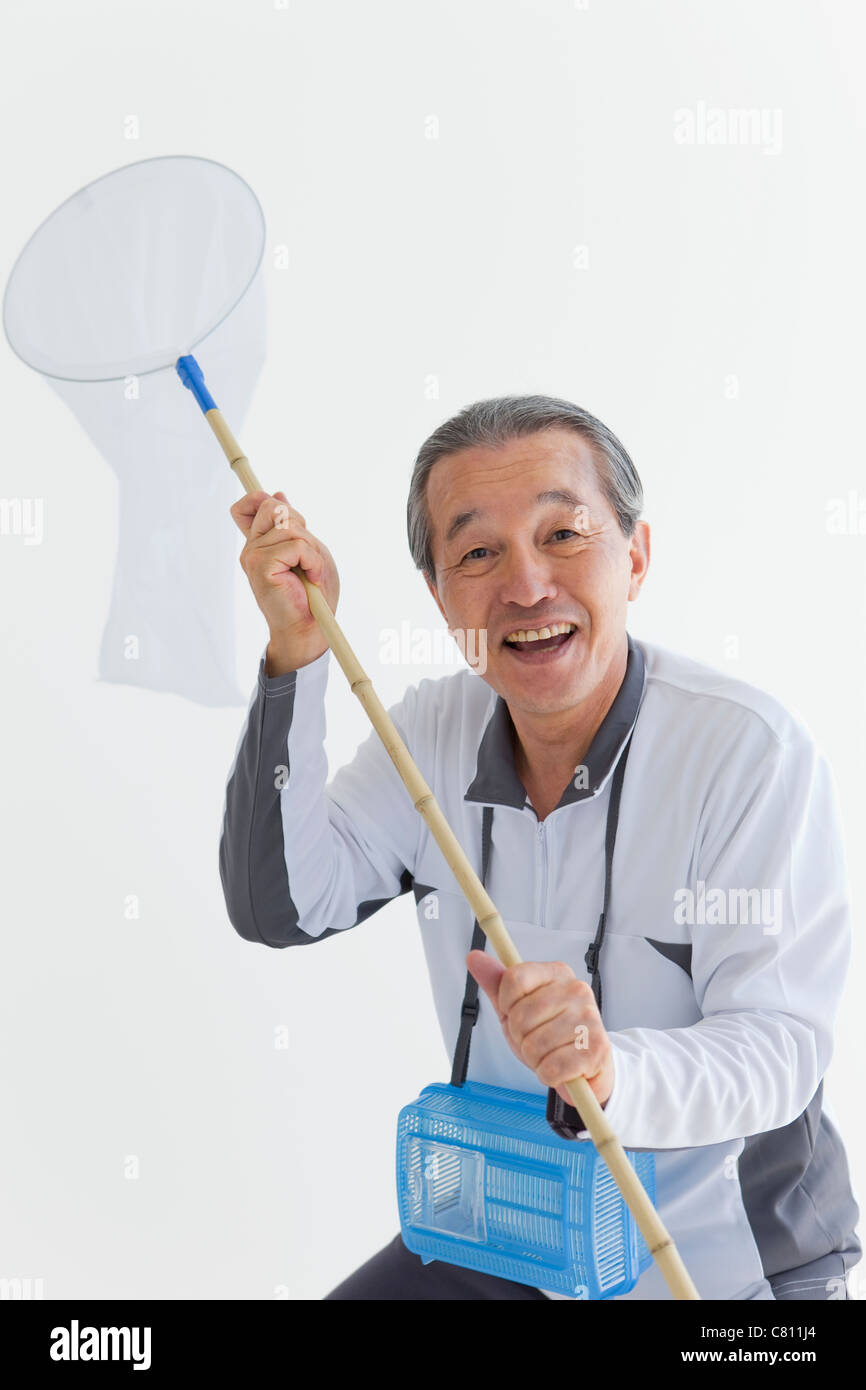 Senior Man with Butterfly Net Stock Photo - Alamy