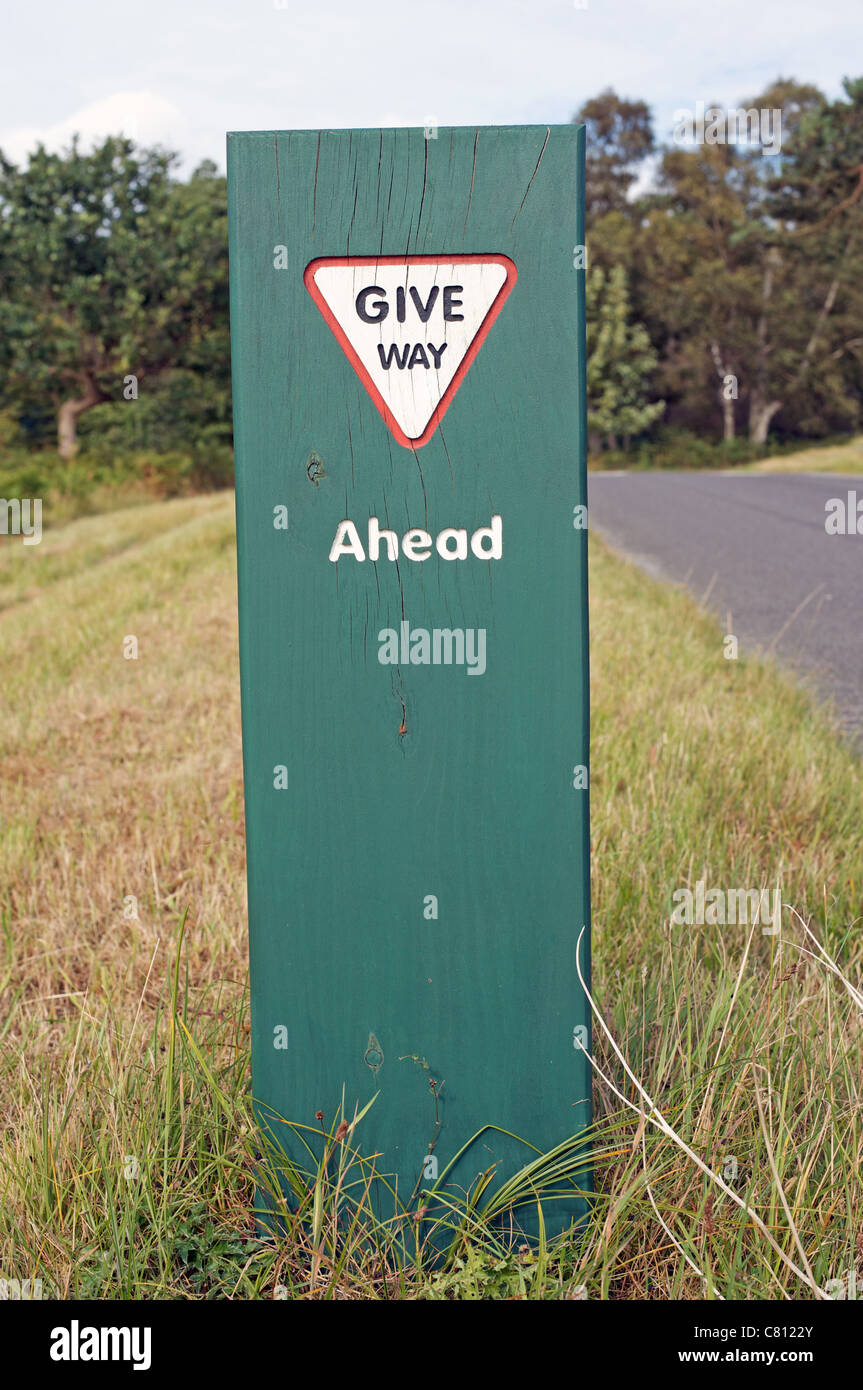 Wooden give way road traffic sign Stock Photo - Alamy