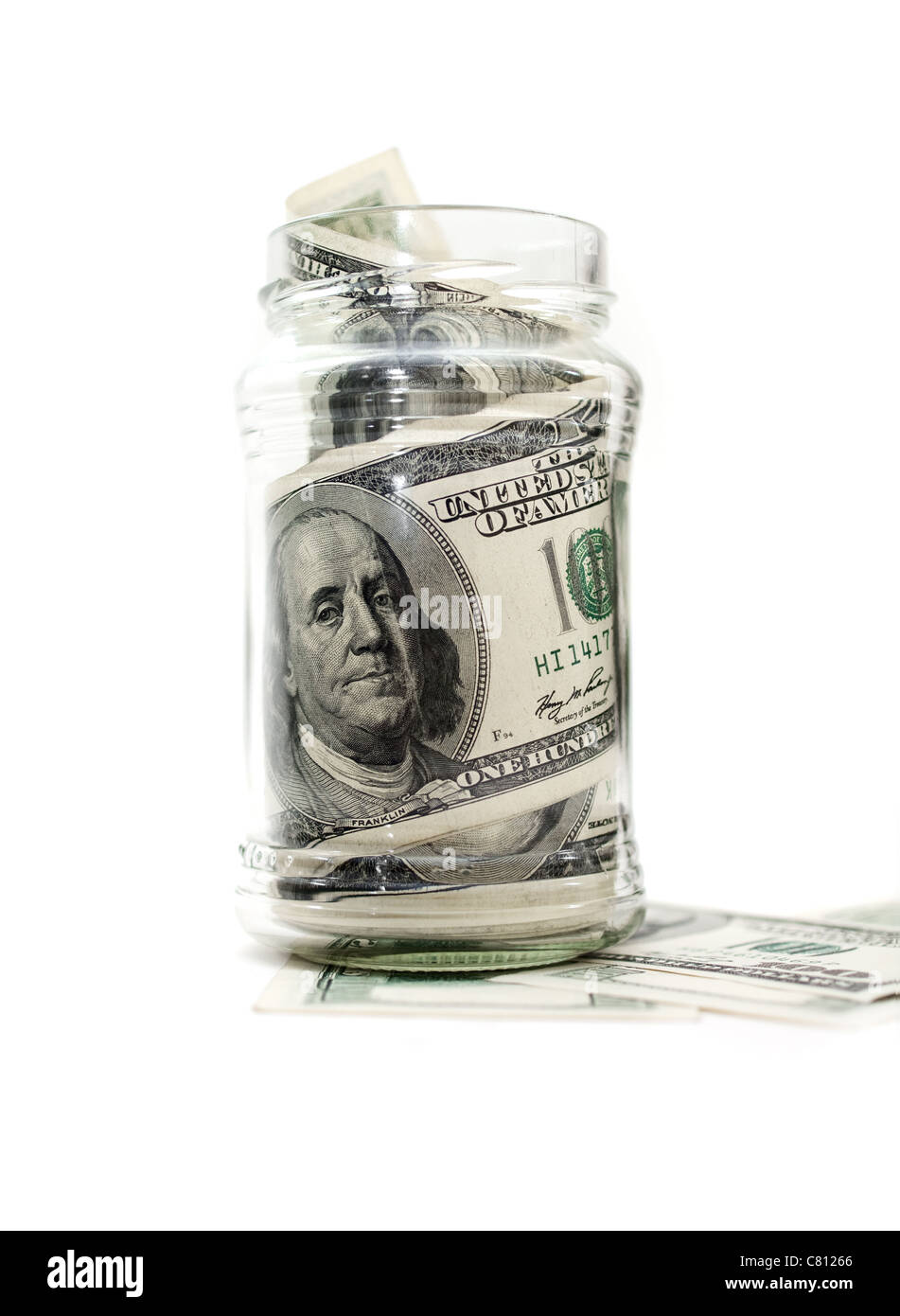 dollars in money jar isolated on white background Stock Photo - Alamy