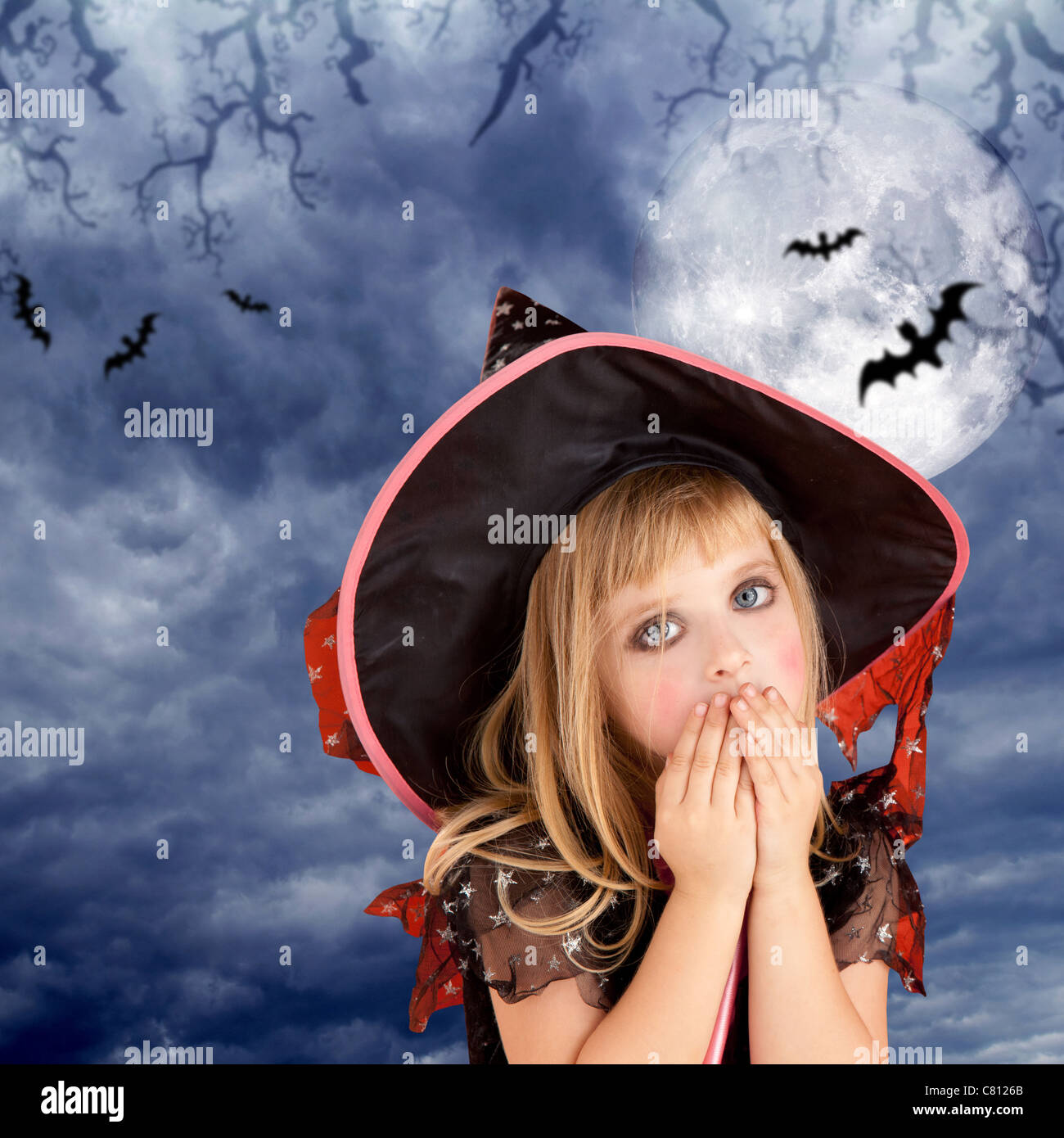 Halloween scared kid girl on dark sky and moon with bat Stock Photo - Alamy