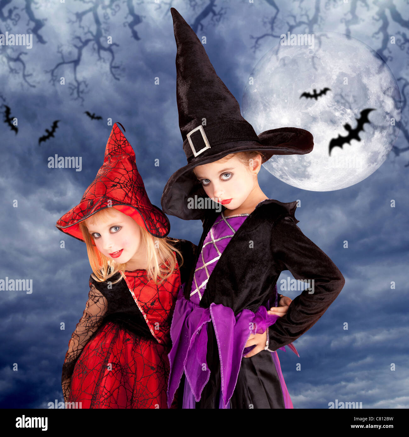 halloween costumes kid girls on moon night sky with bats Stock Photo ...