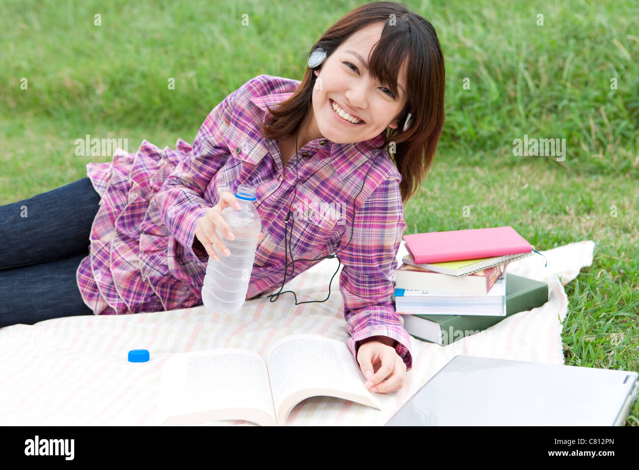 Young Woman Studying Outdoors Stock Photo - Alamy