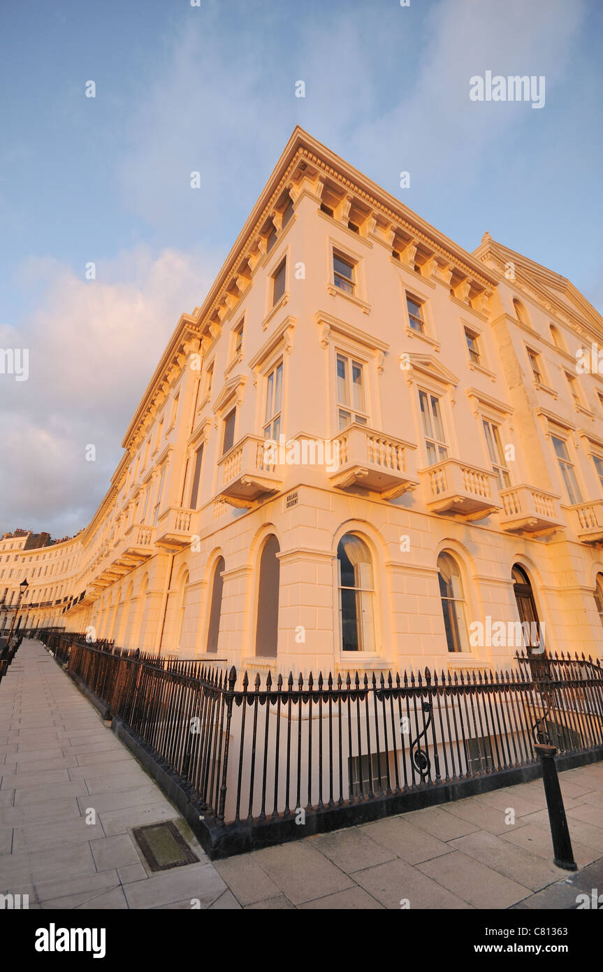 Regency style housing on the Brighton seafront at dusk, Brighton, East ...
