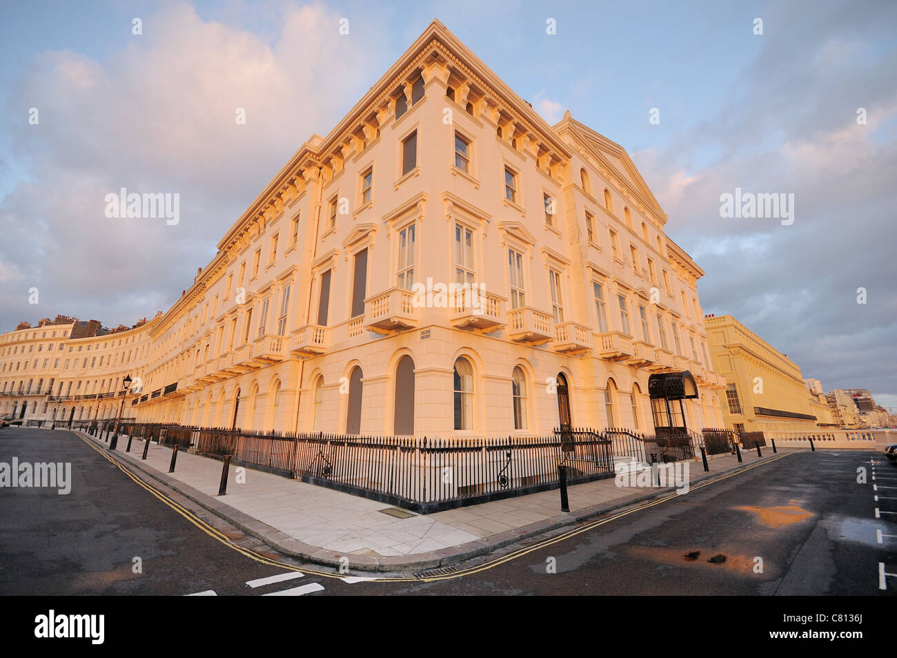 Regency style housing on the Brighton seafront at dusk, Brighton, East ...