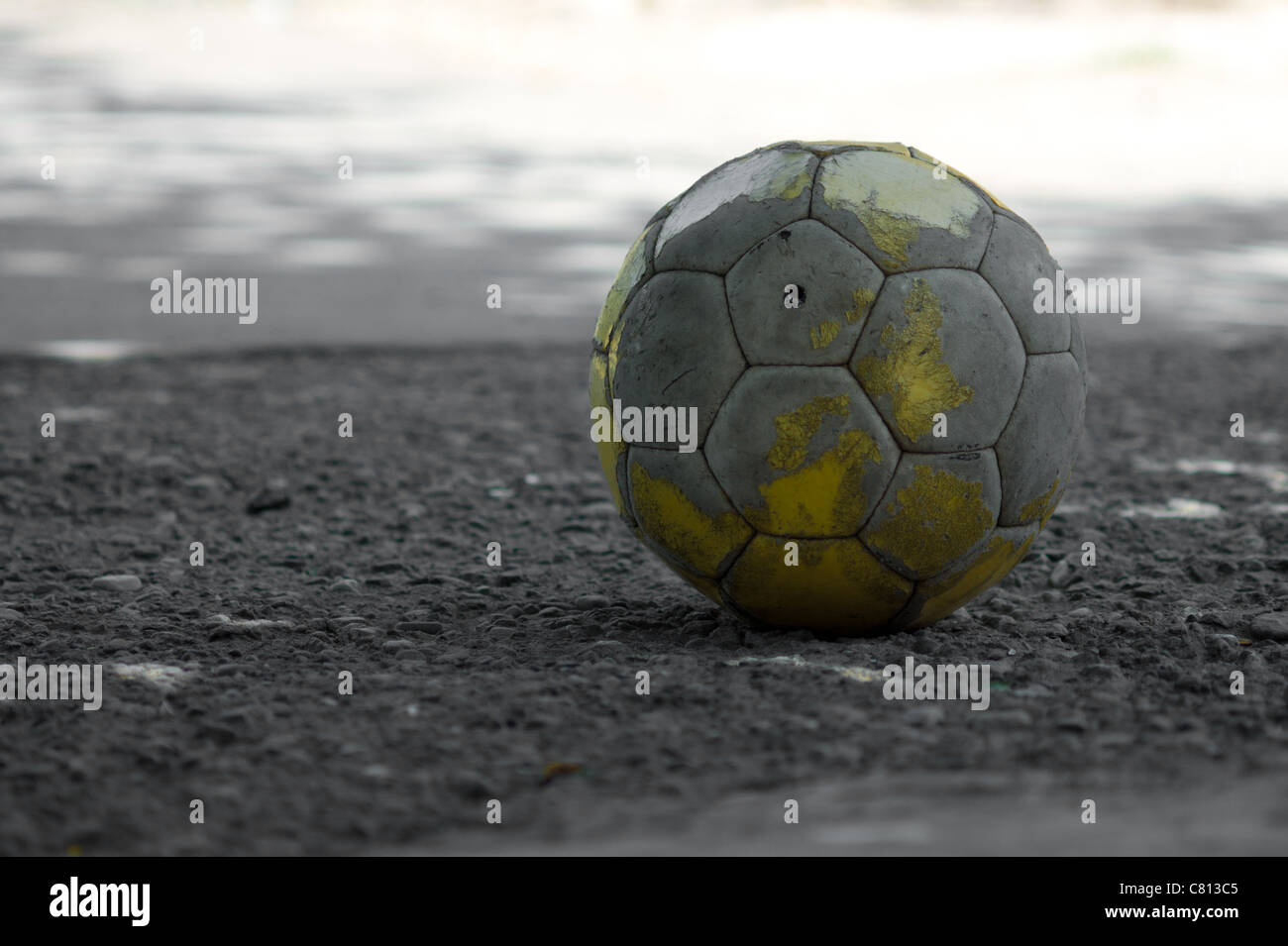 A football ball on the ground Stock Photo - Alamy
