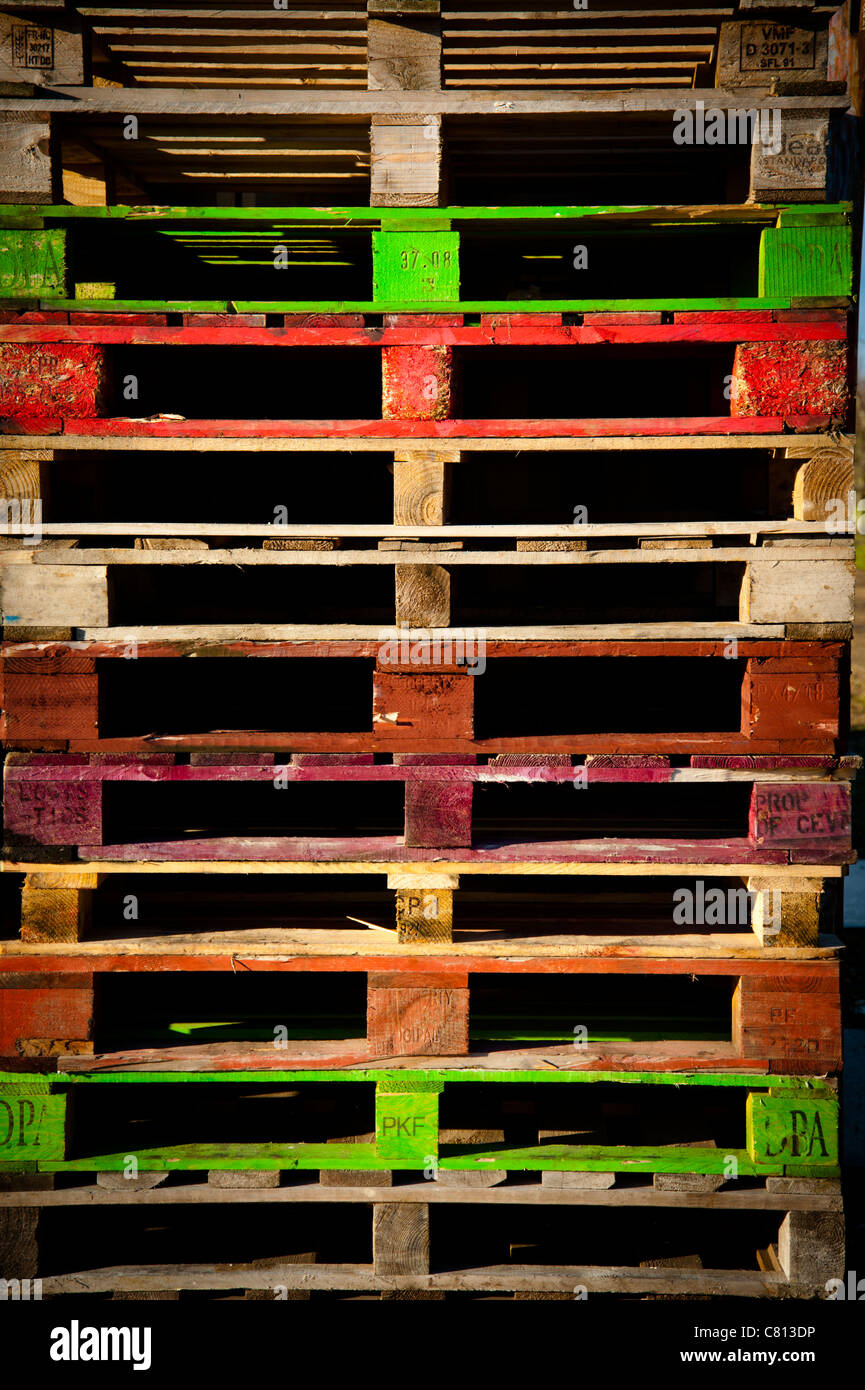 Stacked pallets close up forming interesting and colourful patterns ...