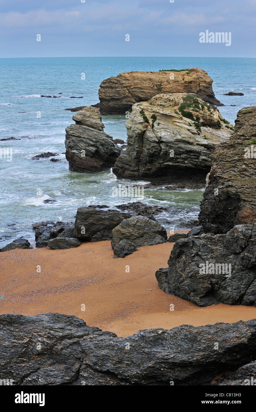 Eroded sea stacks at the Plage des Cinq Pineaux at Saint-Hilaire-de ...