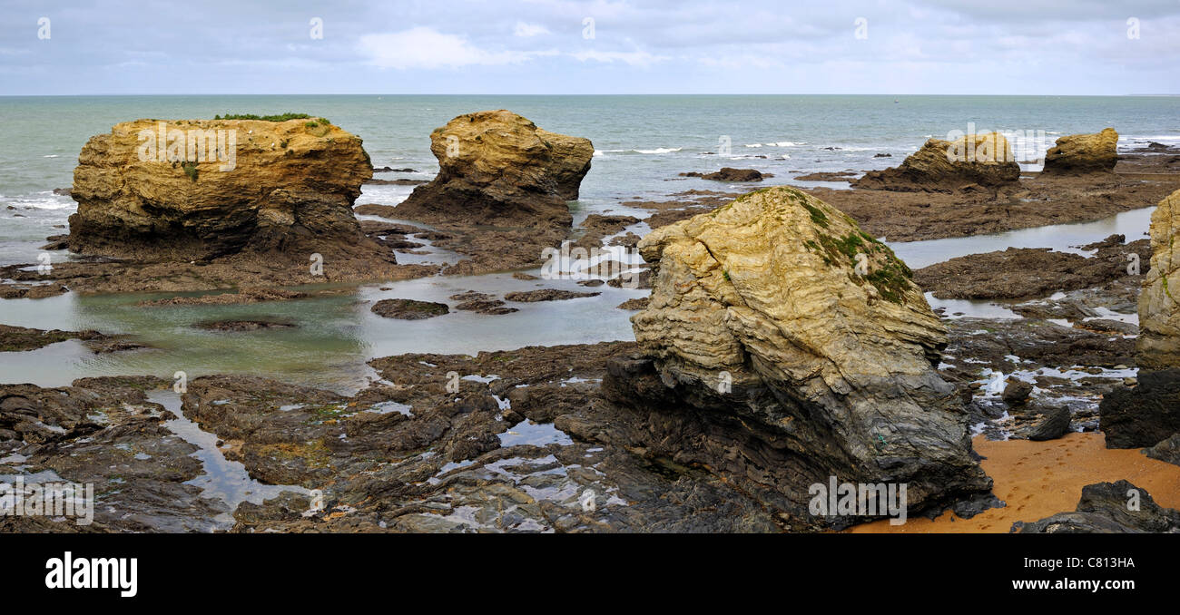 Eroded sea stacks at the Plage des Cinq Pineaux at Saint-Hilaire-de ...