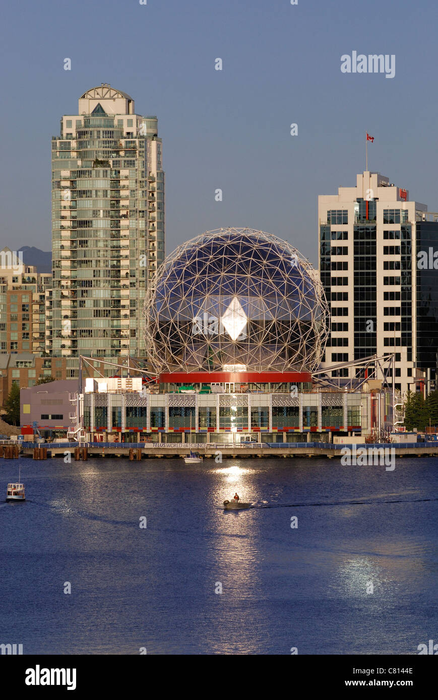 The geodesic dome of Science World at twilight, with the waters of ...