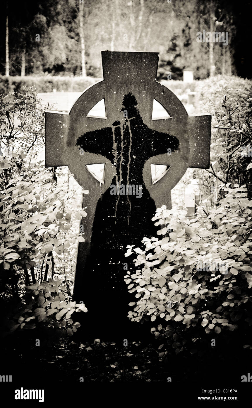 an old and weathered tombstone in a graveyard Stock Photo - Alamy