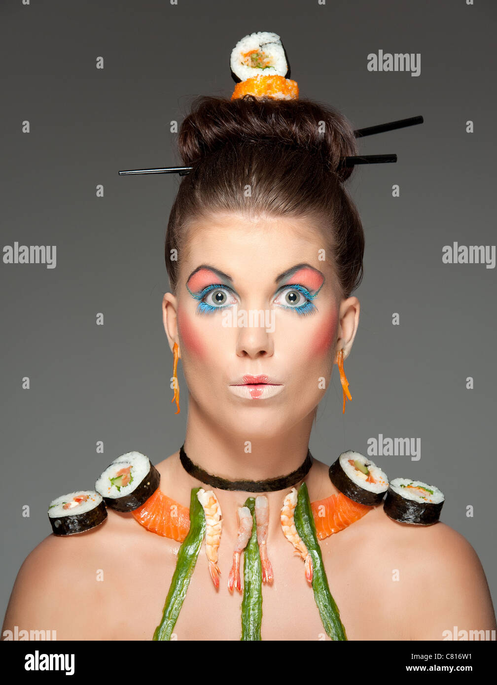 A creative and colorful image of a fashion model wearing asian themed ...