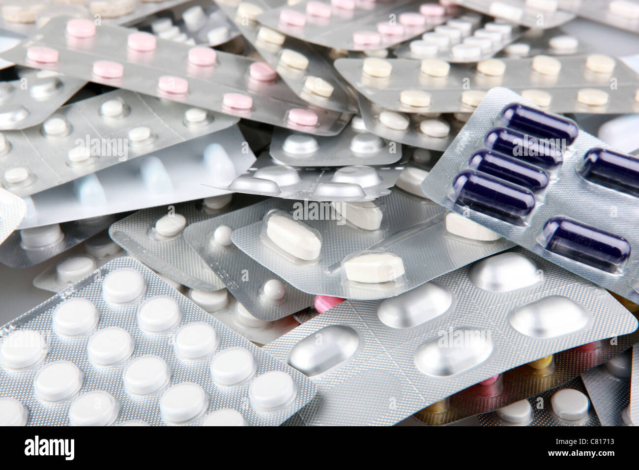 Pills of many shapes and colors Stock Photo - Alamy