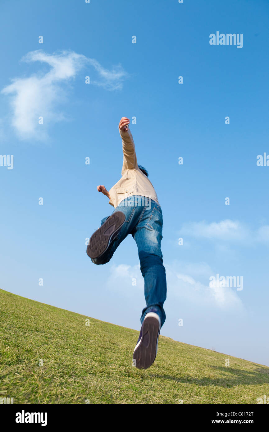 Mid Adult Man Running Stock Photo - Alamy