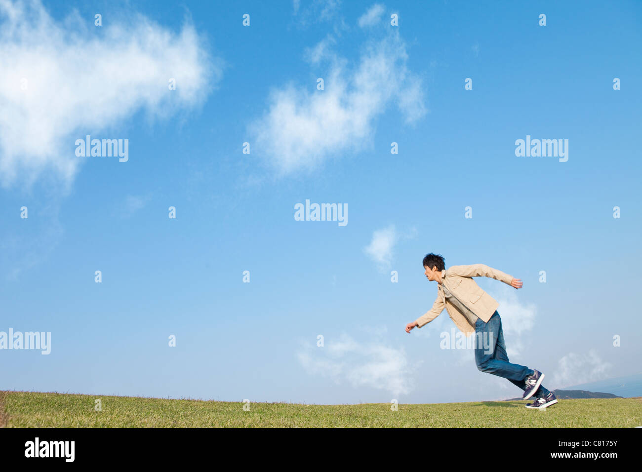 Mid Adult Man Running Stock Photo - Alamy