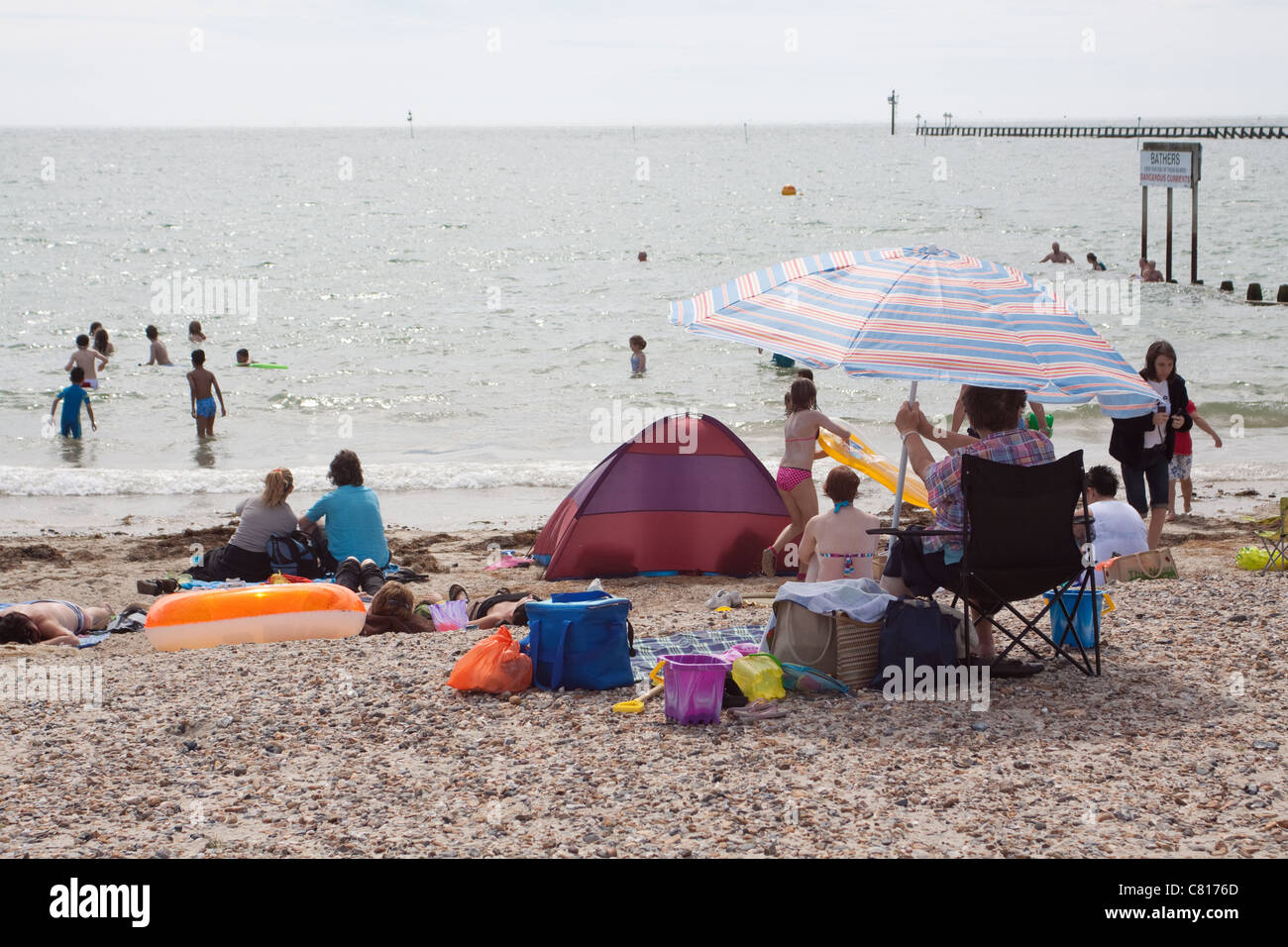 Families swimming and sunbathing on Littlehampton Beach Stock Photo - Alamy