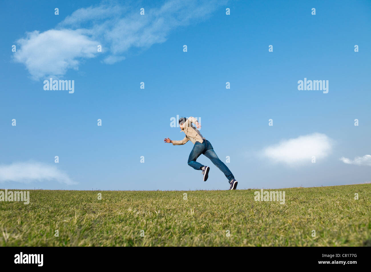 Mid Adult Man Running Stock Photo - Alamy