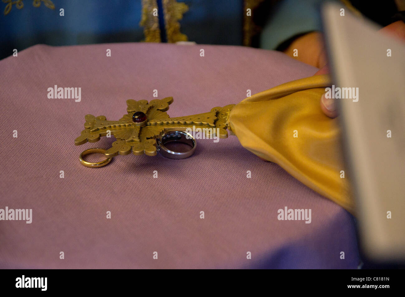 The ceremony where the priest blessing the rings of just-married couple ...