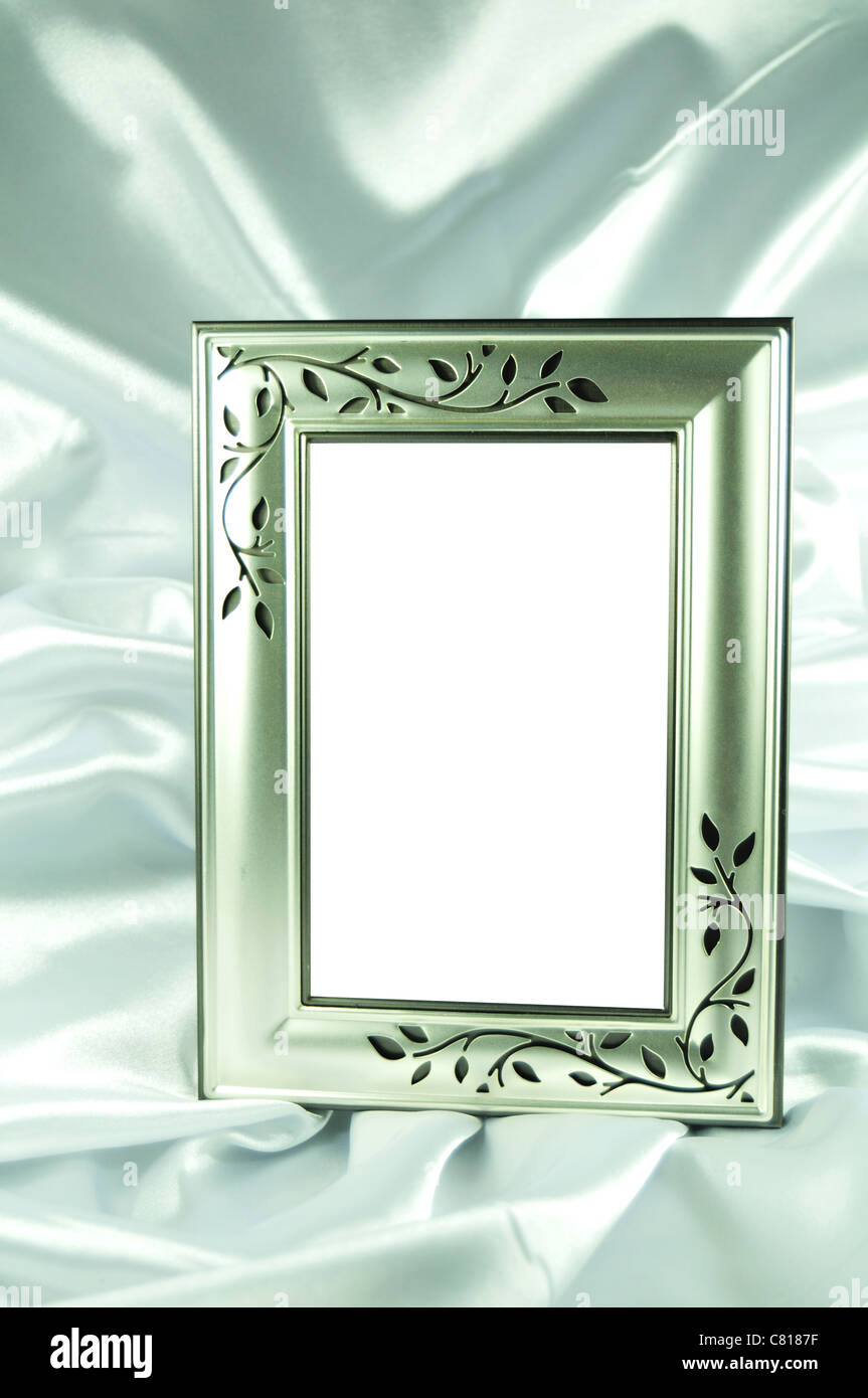 Detail of silver frame against silk background Stock Photo - Alamy