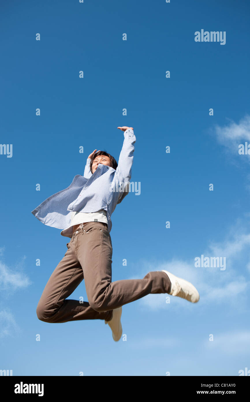 Young Man Jumping Mid Air Stock Photo - Alamy