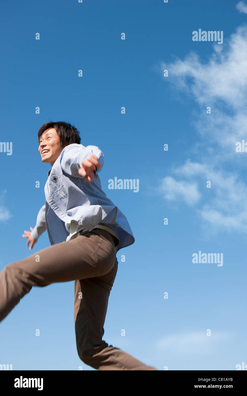 Young Man Jumping Mid Air Stock Photo - Alamy