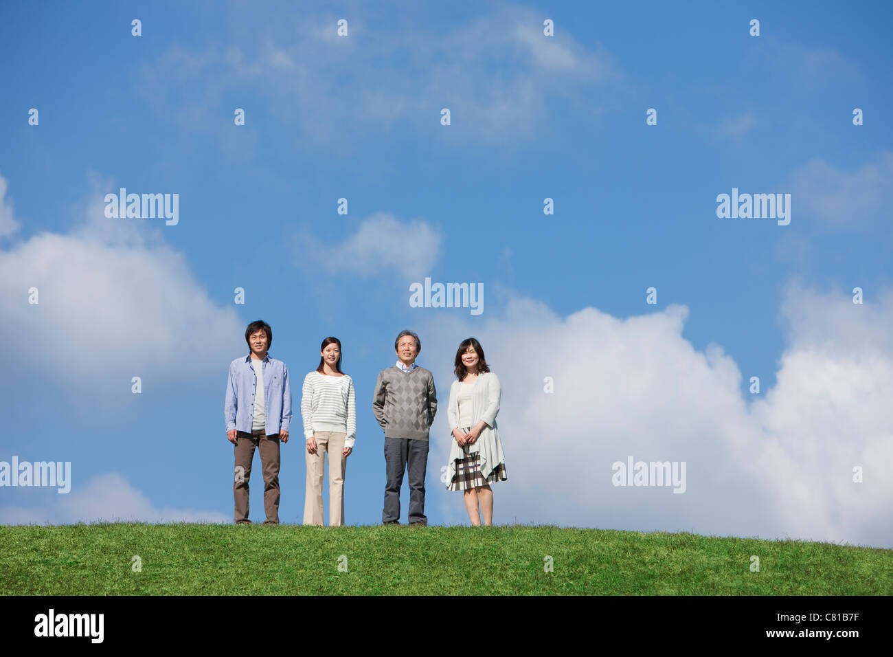 Family of Four with Adult Offspring Stock Photo - Alamy