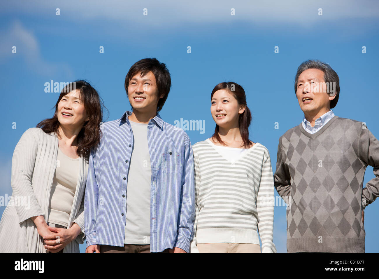 Family of Four with Adult Offspring Stock Photo - Alamy