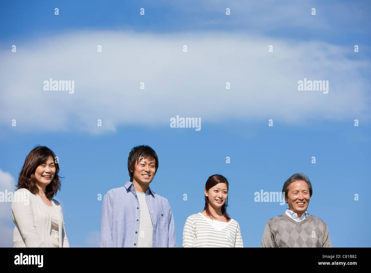 Family of Four with Adult Offspring Stock Photo - Alamy