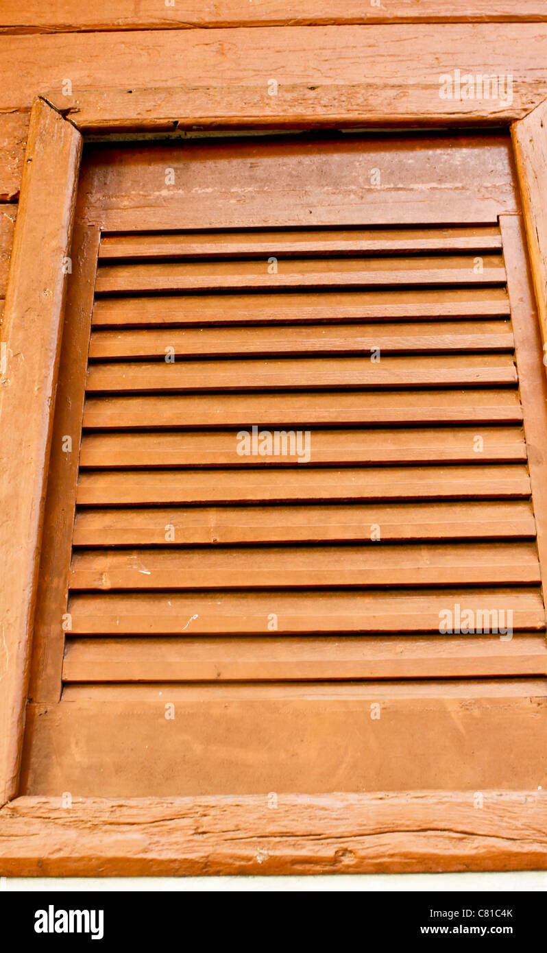 Closed window with old wood shutters Stock Photo - Alamy