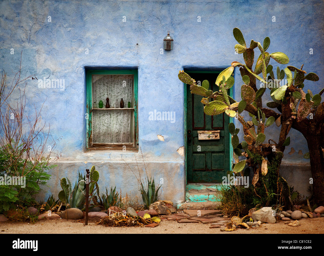 Old blue painted adobe house Stock Photo - Alamy