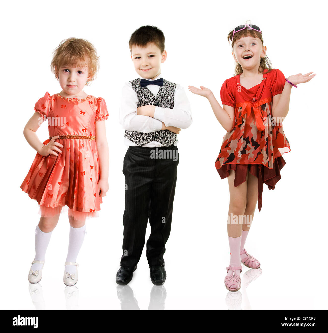 3 fashionable children stand on a white background Stock Photo - Alamy
