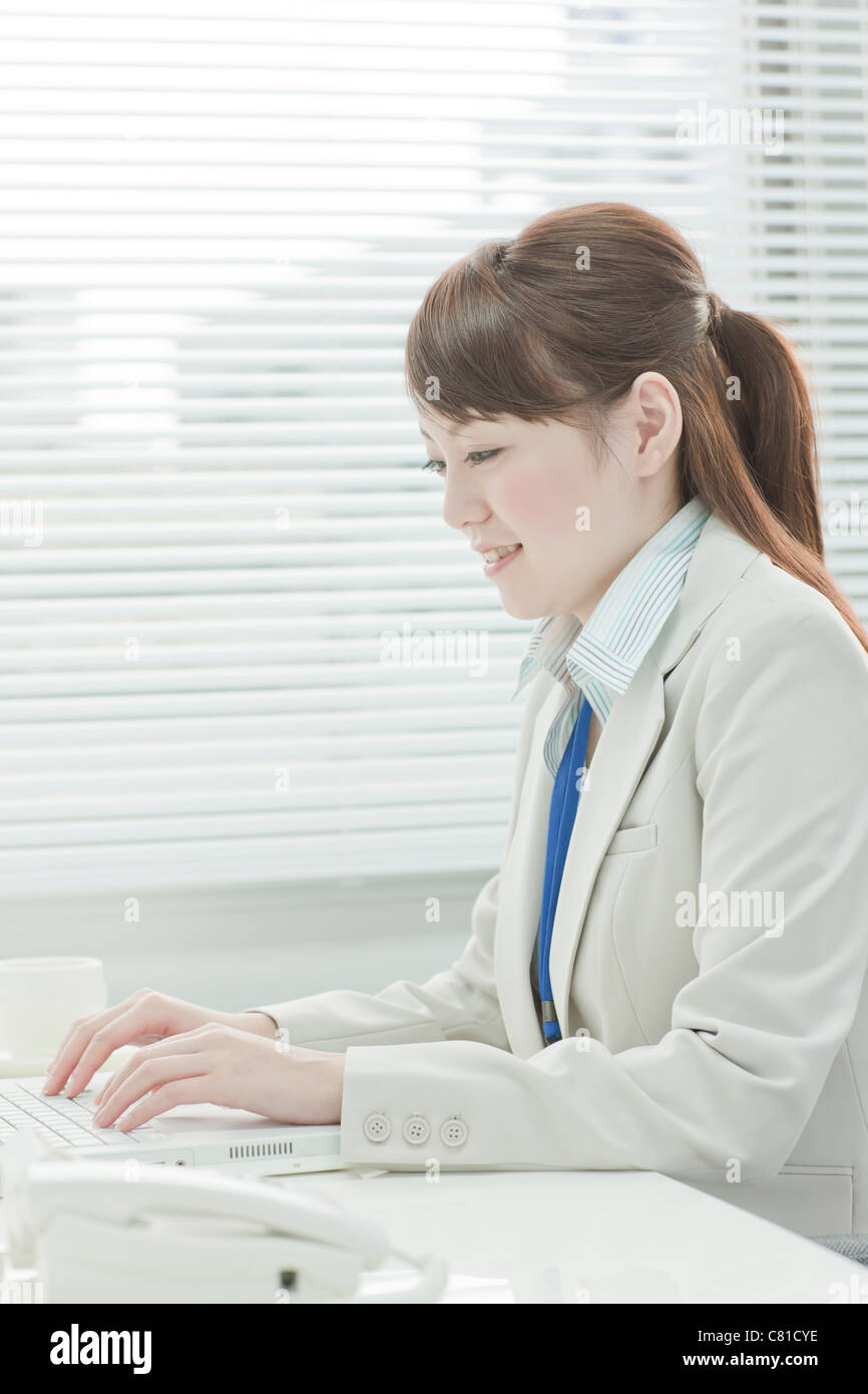 Businesswoman Using Laptop Stock Photo - Alamy Businesswoman Using Laptop Stock Photo - Alamy