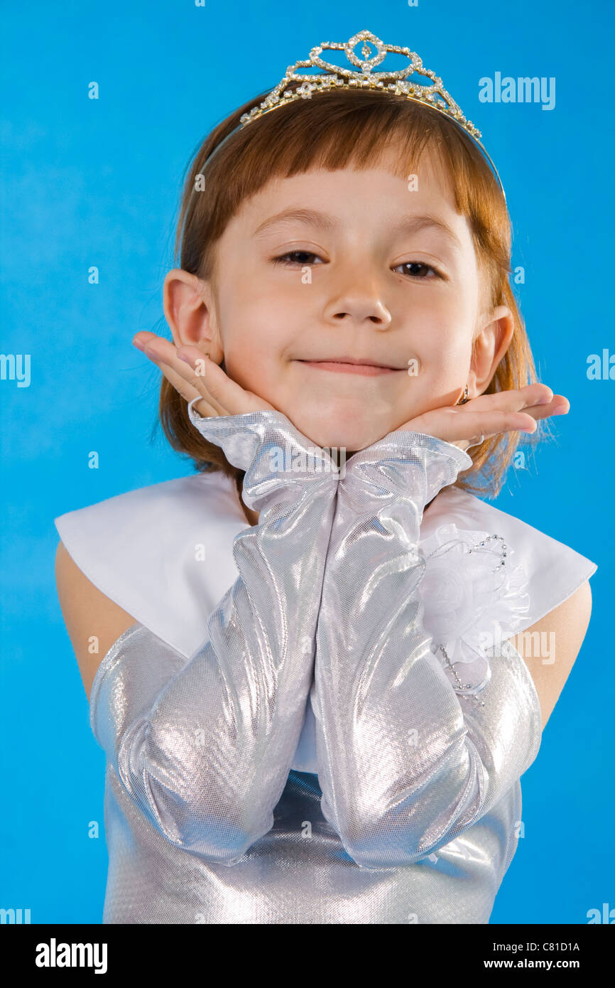 The girl the princess in a white dress sits opposite to a blue ...