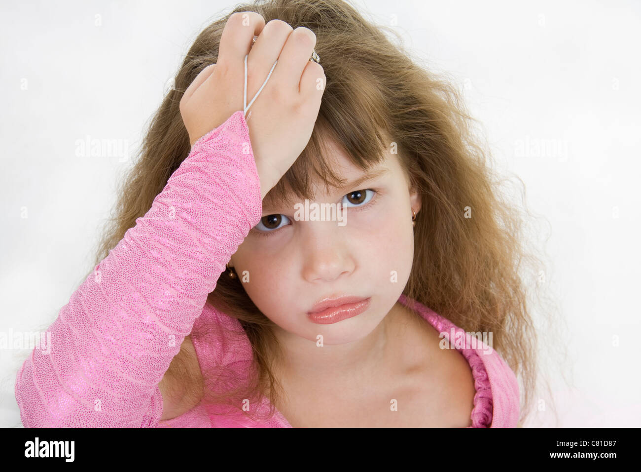 Sad little girl looking at Camera Stock Photo - Alamy