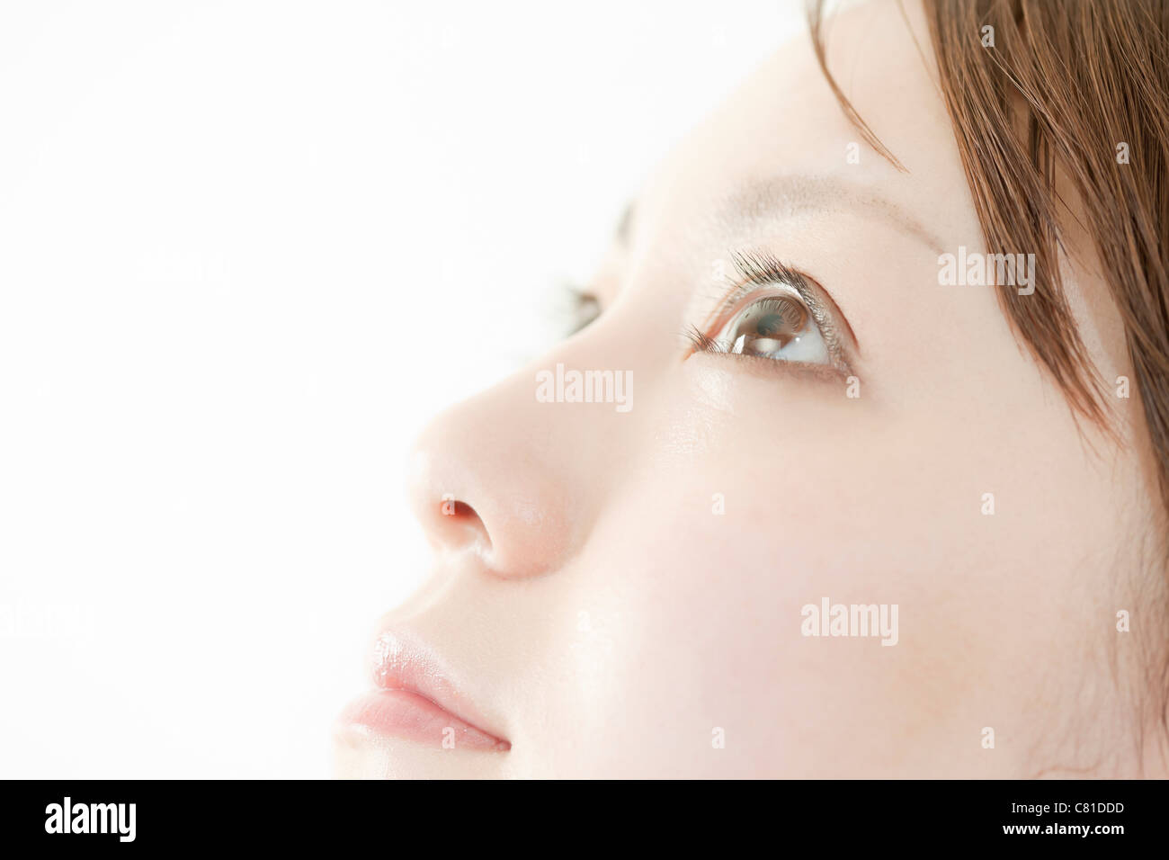 Young Woman Looking Up, Profile Stock Photo - Alamy