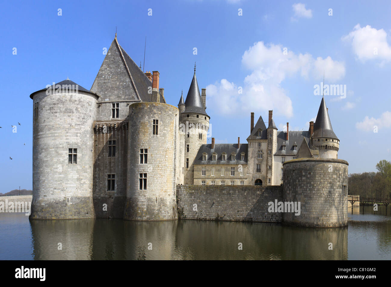a medieval castle with its moats, towers and dungeon Stock Photo - Alamy