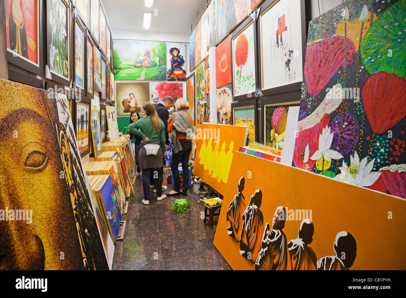 Vietnam, Hanoi, Tourists Shopping in Art Shop Stock Photo - Alamy
