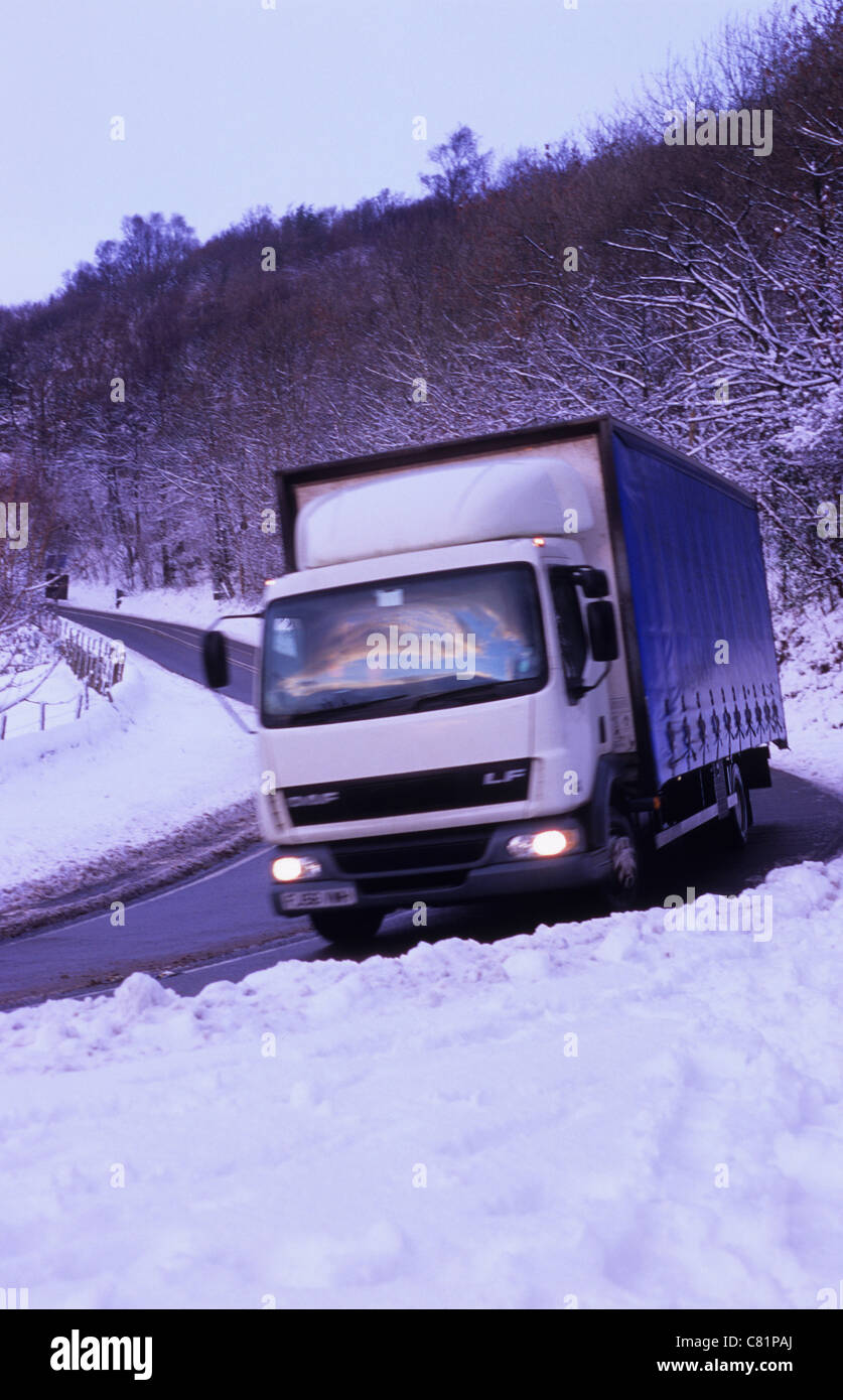 lorry travelling through winter snow at Sutton Bank near Thirsk ...