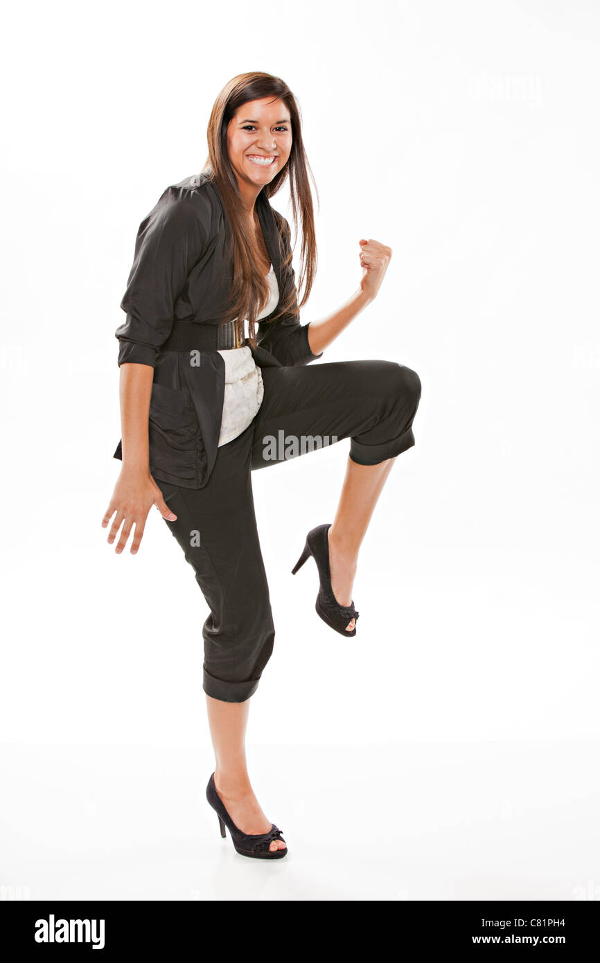 An cute attractive teenage female girl excited on a white background ...