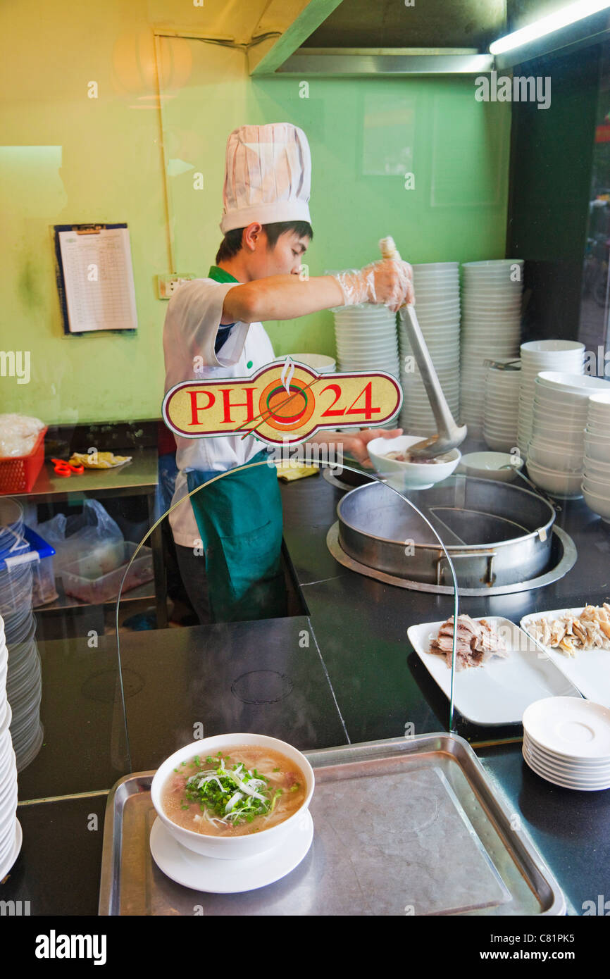 Vietnam, Hanoi, Chef at the Popular Pho 24 Restaurant Chain Cooking Pho ...