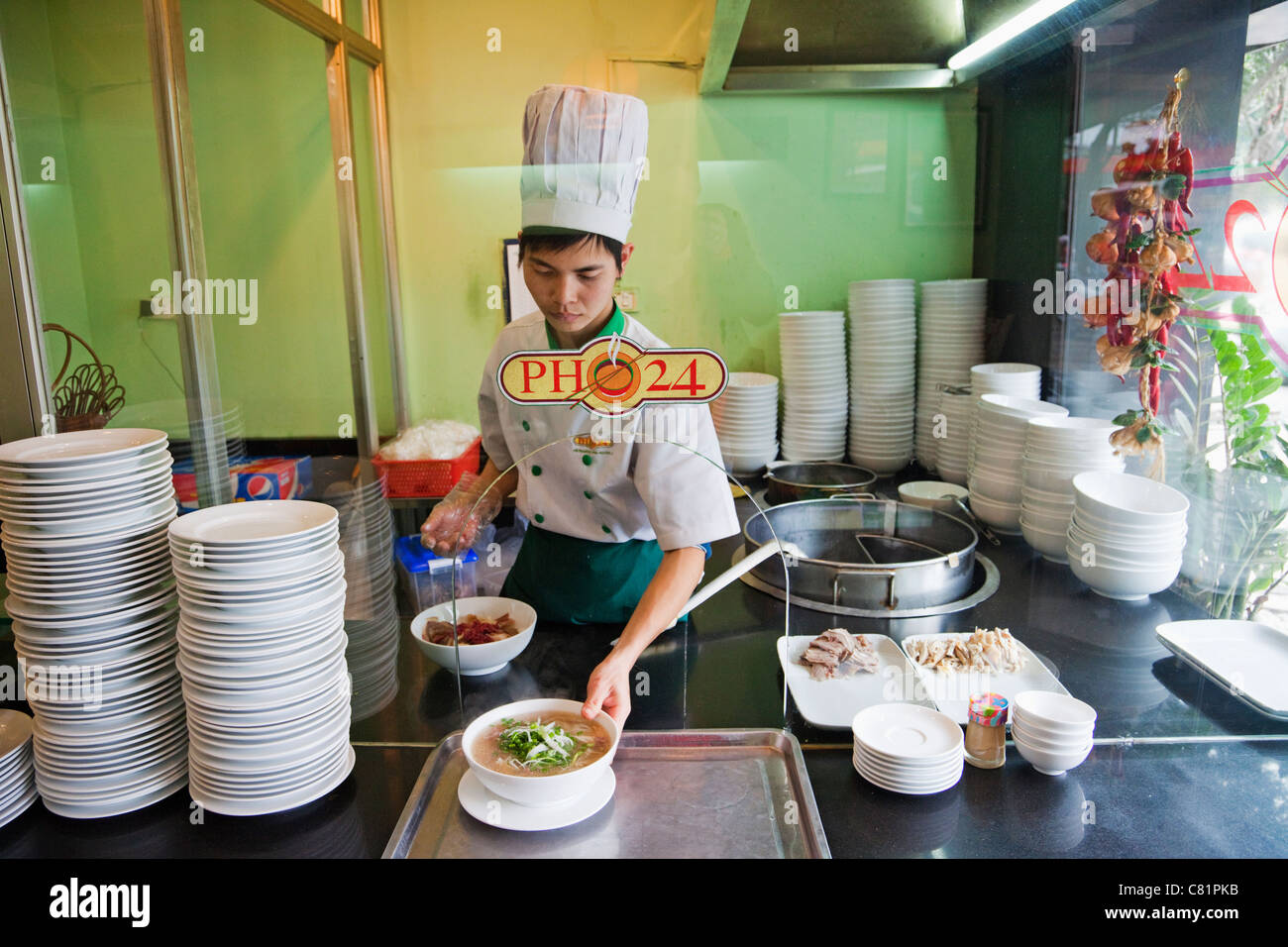 Vietnam, Hanoi, Chef at the Popular Pho 24 Restaurant Chain Cooking Pho ...