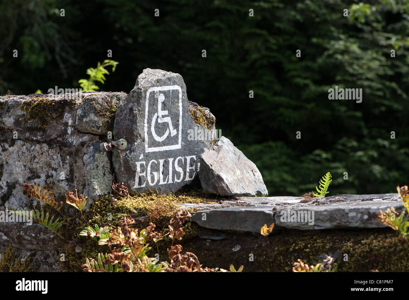 A disabled sign outside a church in Brittany, France Stock Photo - Alamy